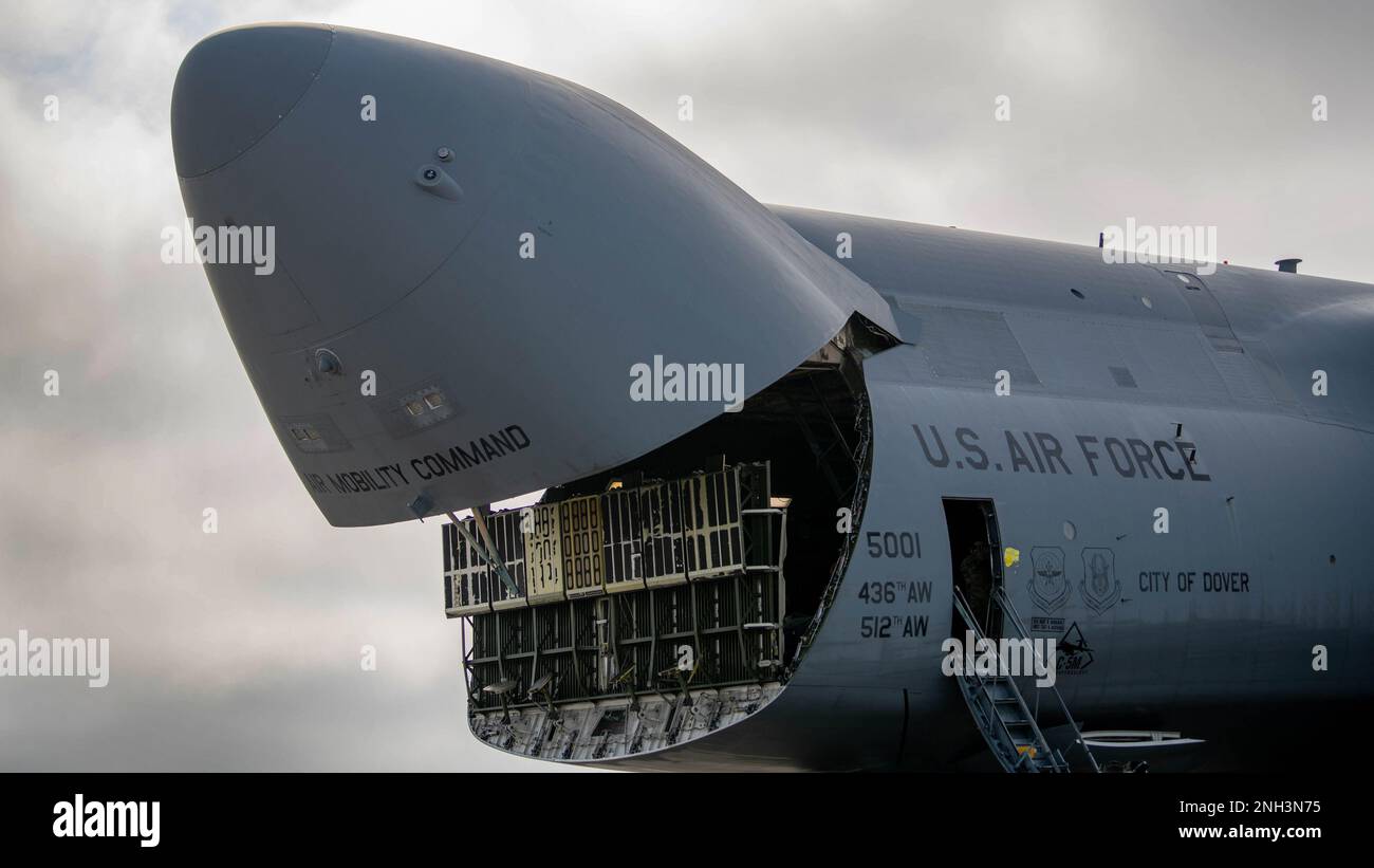 A U.S. Air Force C-5 Galaxy opens its front cargo entrance to load an F ...