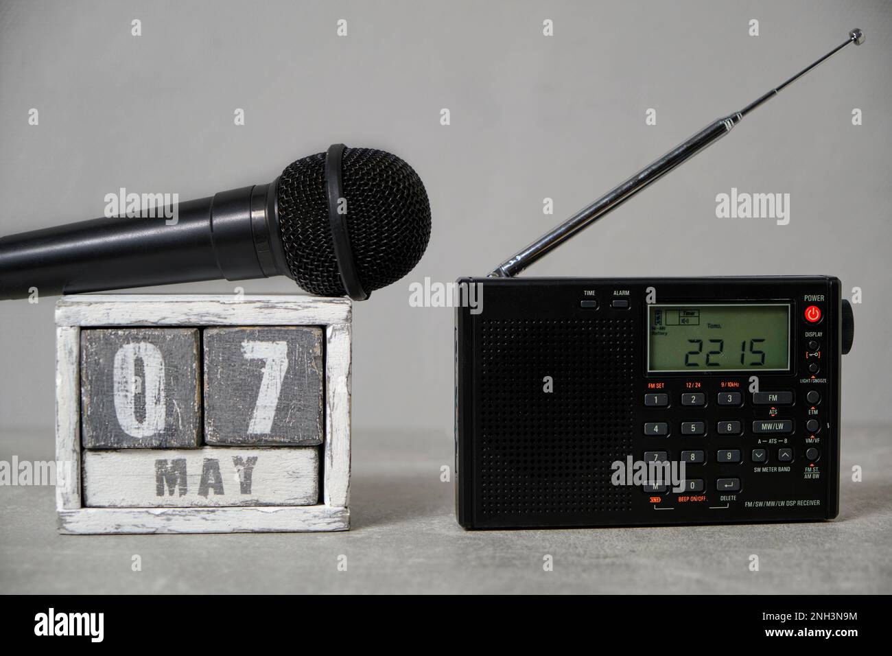 May 07, wooden calendar radio receiver and microphone gray background ...