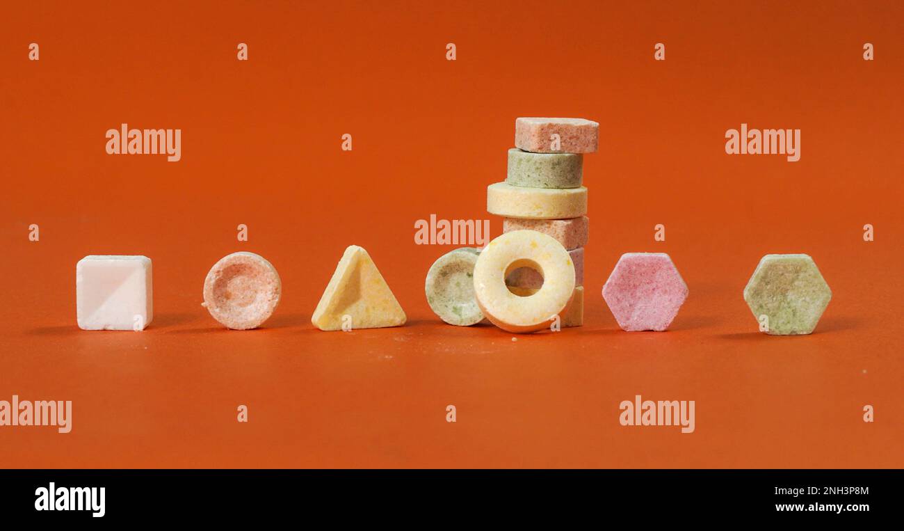 various tablet hard candies with different fruit taste and geometric ...