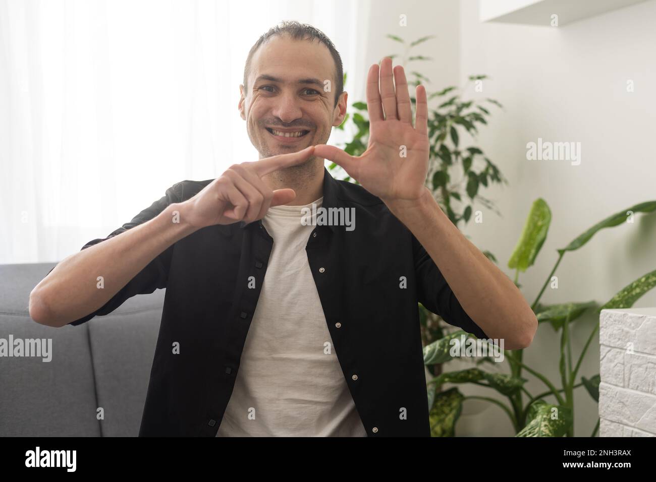 Adult Learning Sign Language For Deaf Disabled Stock Photo - Alamy