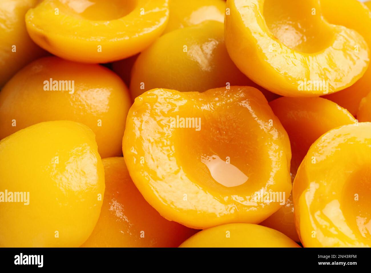 Halves of canned peaches as background, closeup Stock Photo - Alamy