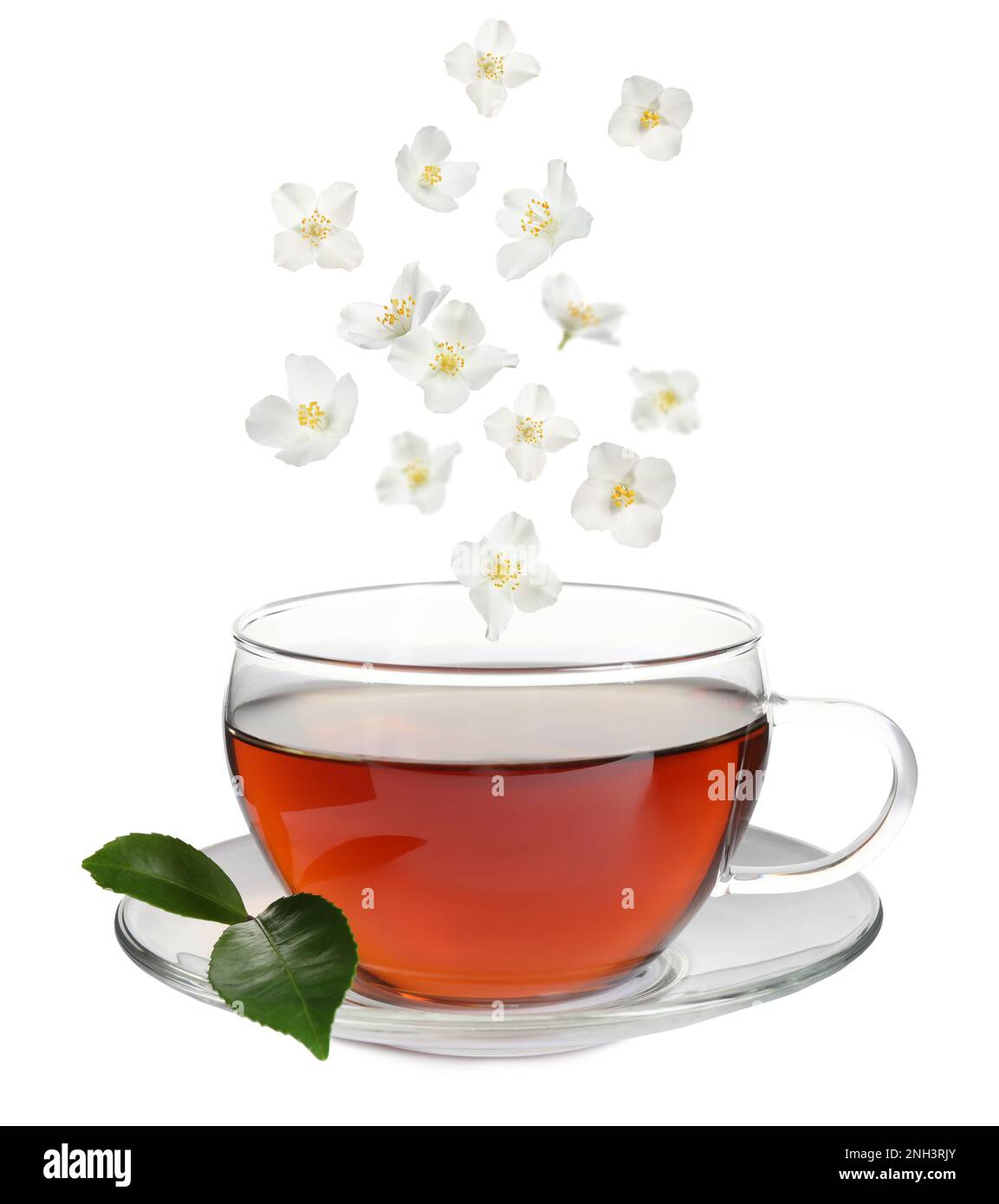 Beautiful jasmine flowers falling into cup of hot freshly brewed tea on ...