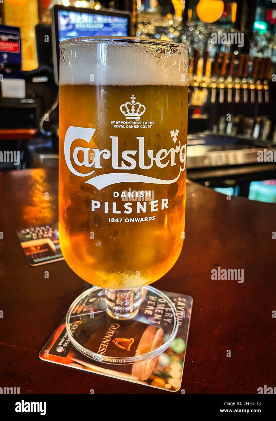 An ice cold pint of Carlserg Pilsner in an Irish pub Stock Photo - Alamy