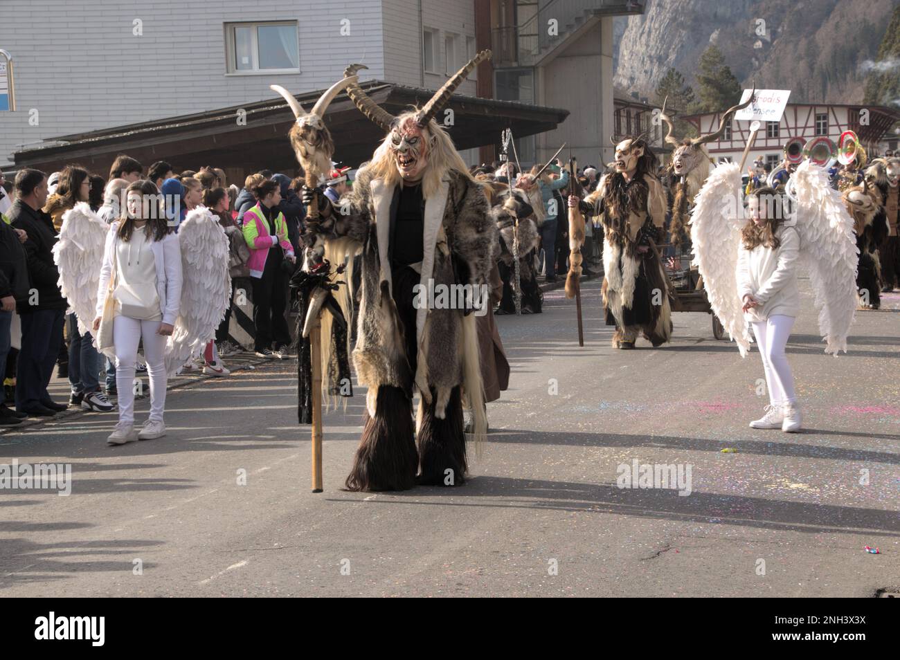 Demon and angel costumes at the Walenstadt Fasnacht procession in the ...