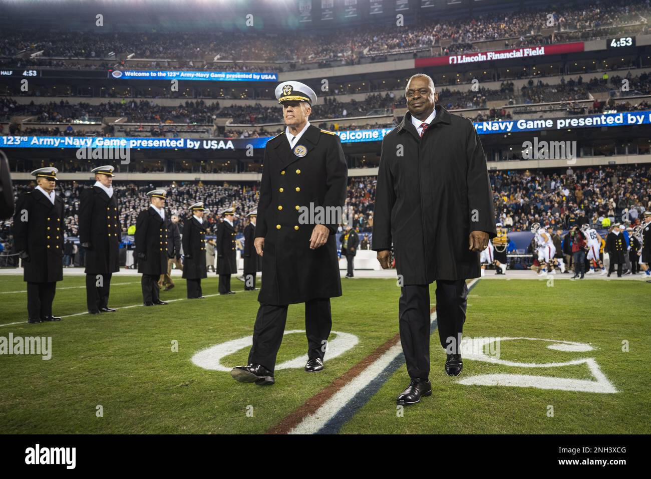 Secretary of Defense Lloyd J. Austin III walks midfield with U.S. Naval ...