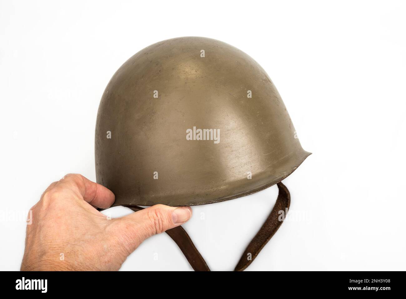 Old and used metal army helmet on a white Stock Photo - Alamy