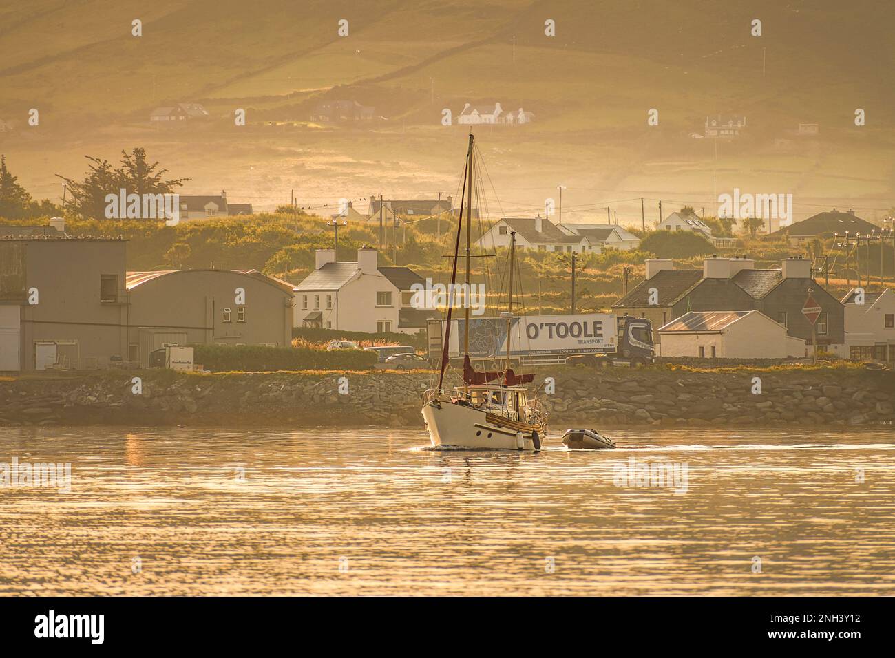 Sailing boat leaving Valencia Harbour between Valentia and Beginish ...