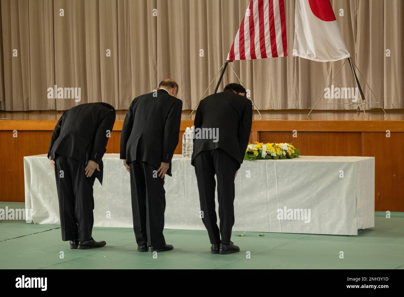 Government of Japan representatives bow during the 2022 Reunion of ...