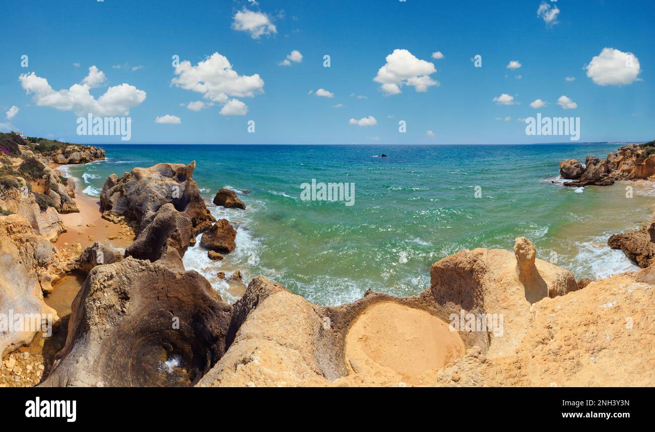 Summer Atlantic rocky coast view (Albufeira outskirts, Algarve, Portugal). Three shots stitch ...