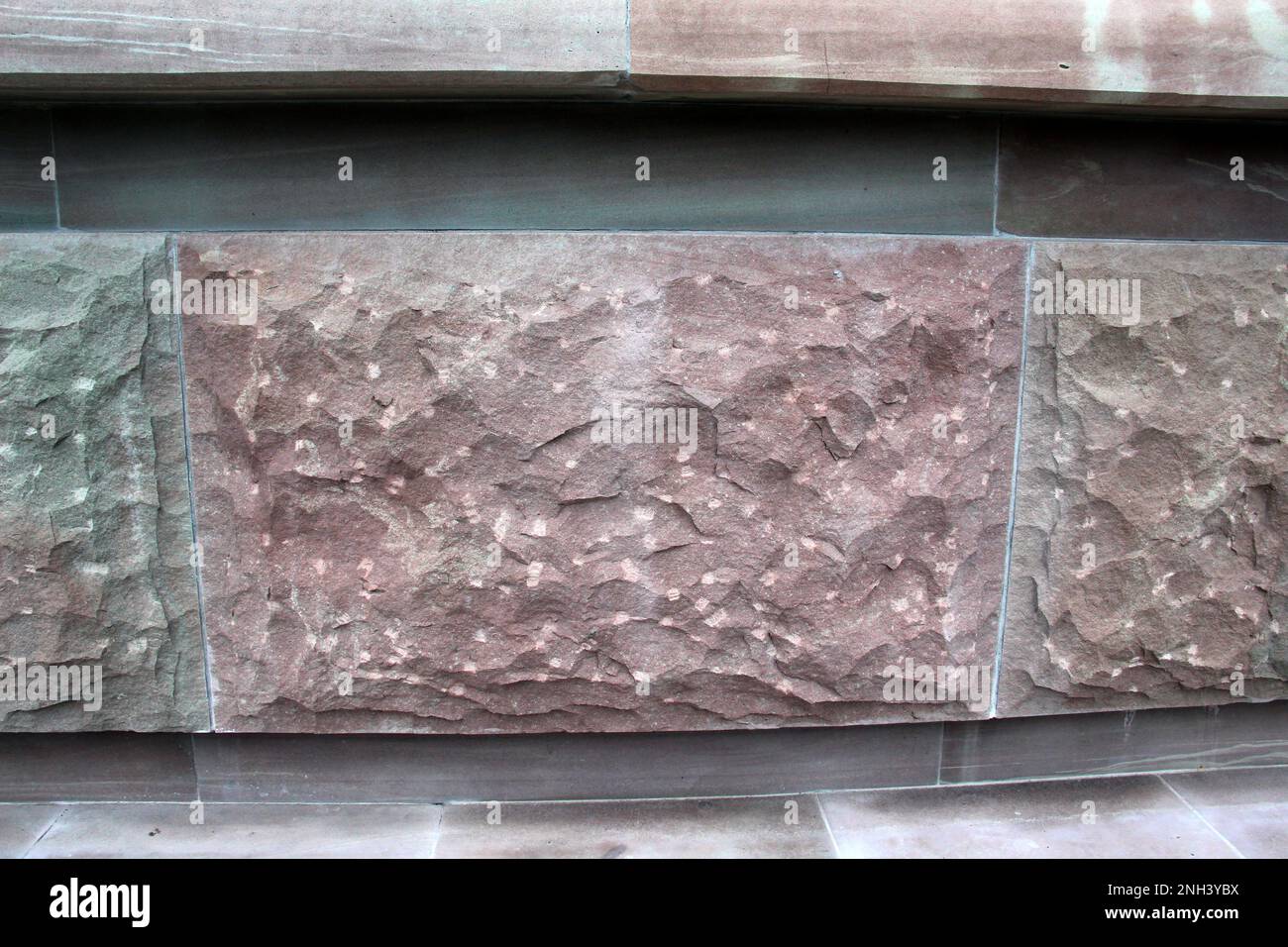 Split and processed red natural stone is used in construction Stock ...