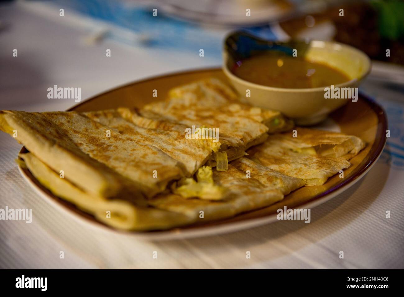 Roti Talur Sliced with a curry sauce Stock Photo - Alamy