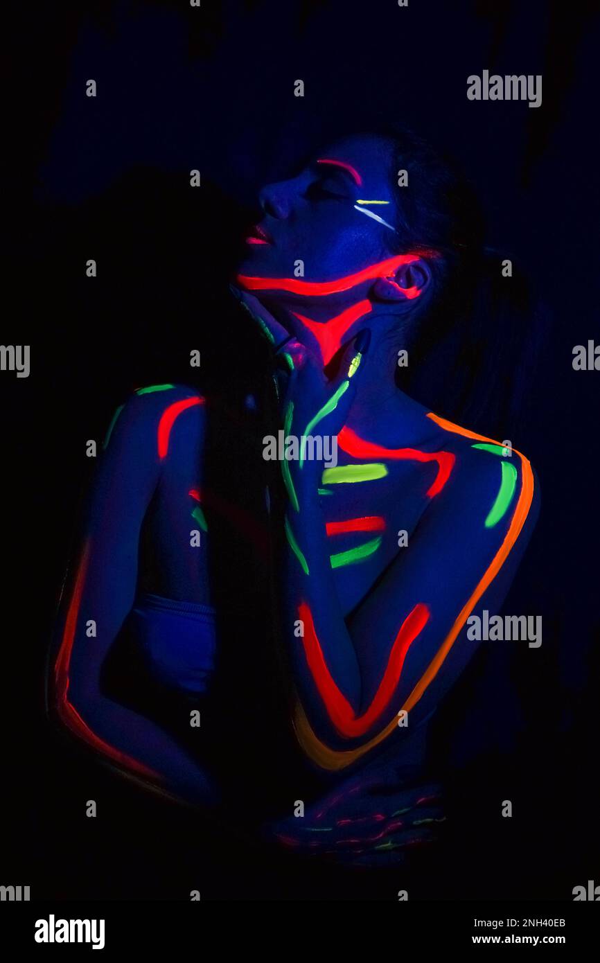 Fashion model woman in neon light, portrait of a beautiful model with ...