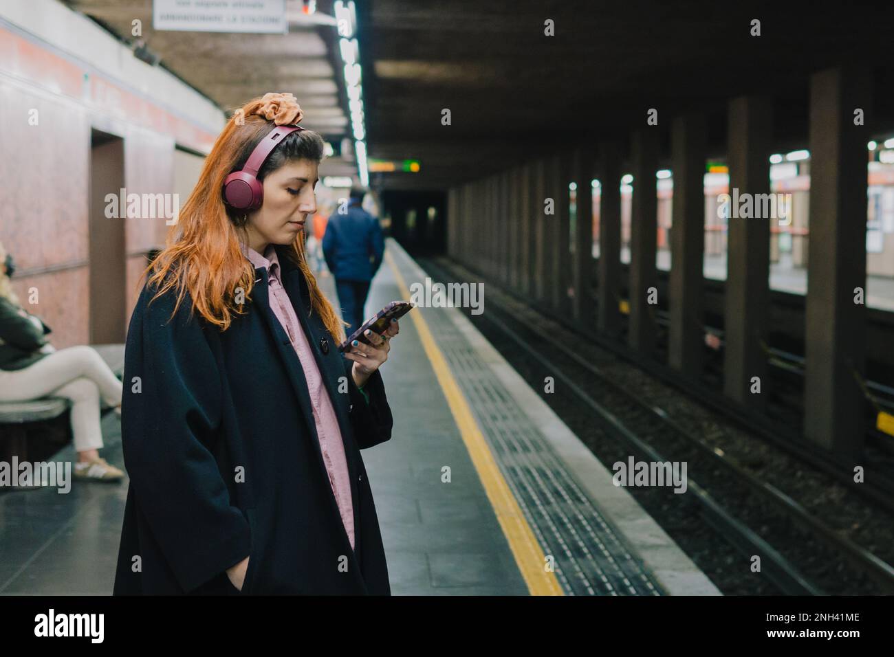 Woman with headphones metro hi-res stock photography and images - Alamy