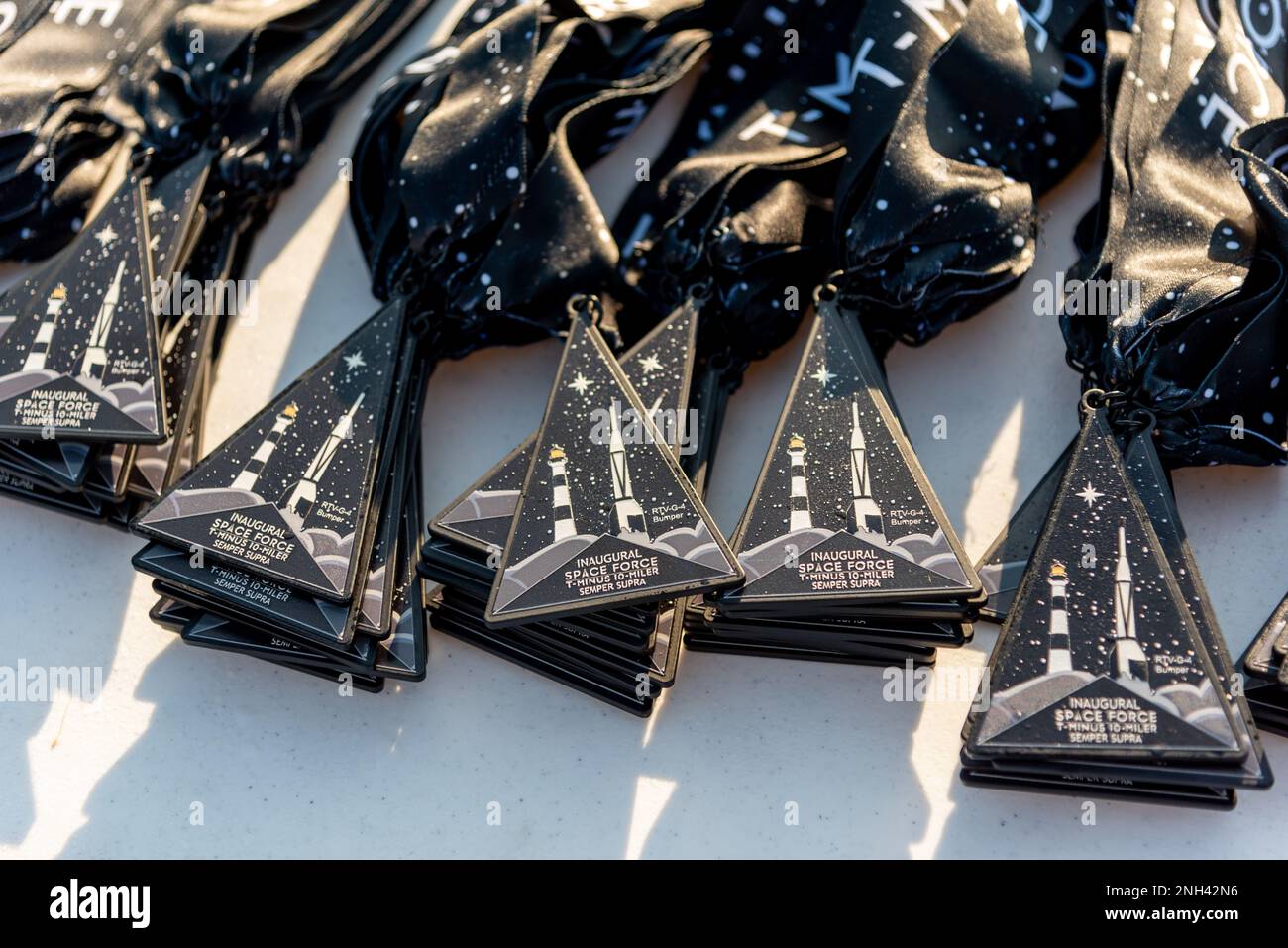 T-Minus 10-Miler participant medals stacked on a table on Dec. 10, 2022 ...