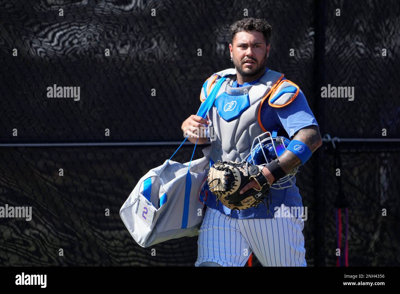 New York Mets catcher Omar Narvaez walks with his bag during spring ...