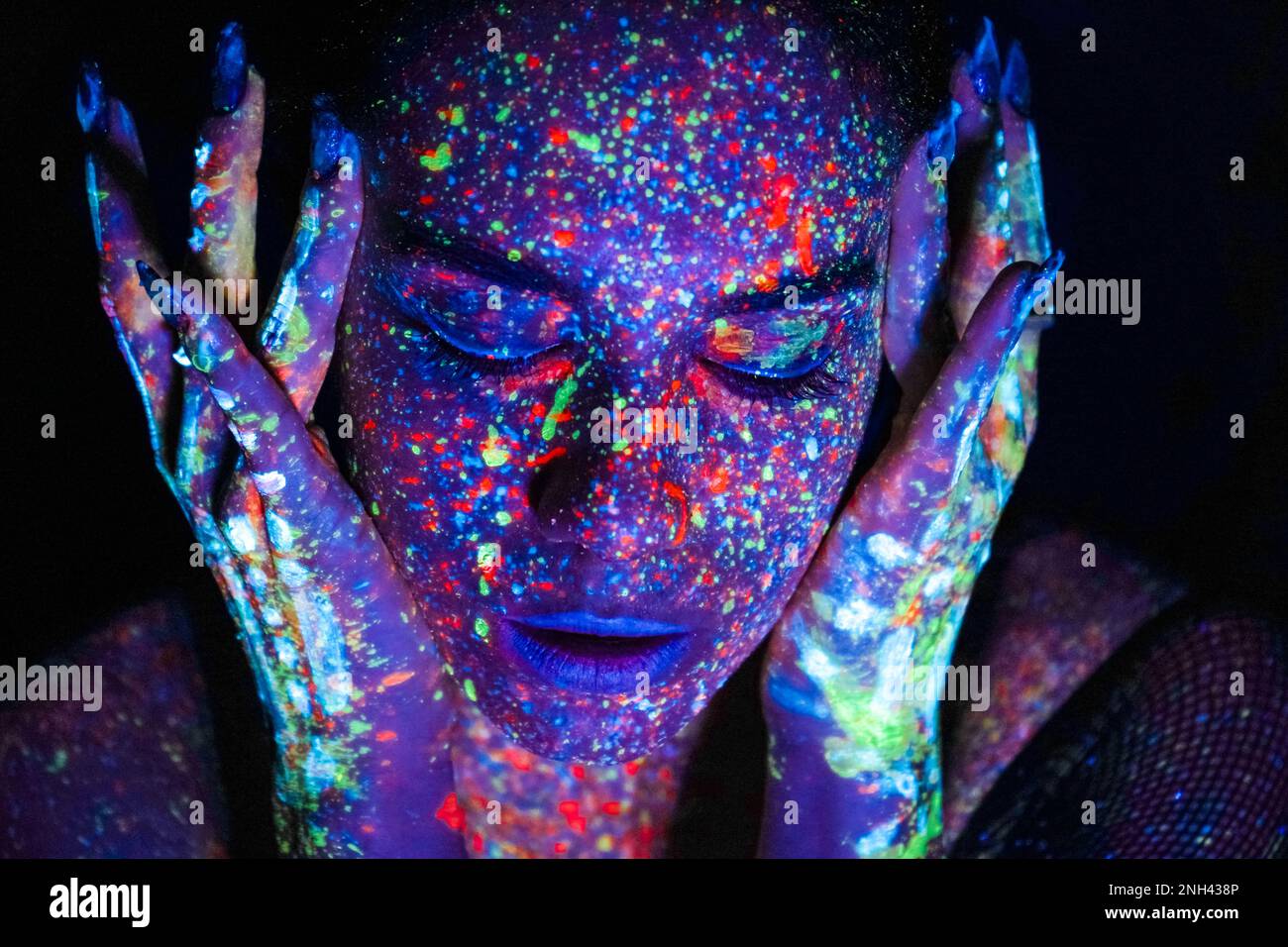 Model woman in neon light, beautiful model girl with fluorescent makeup ...