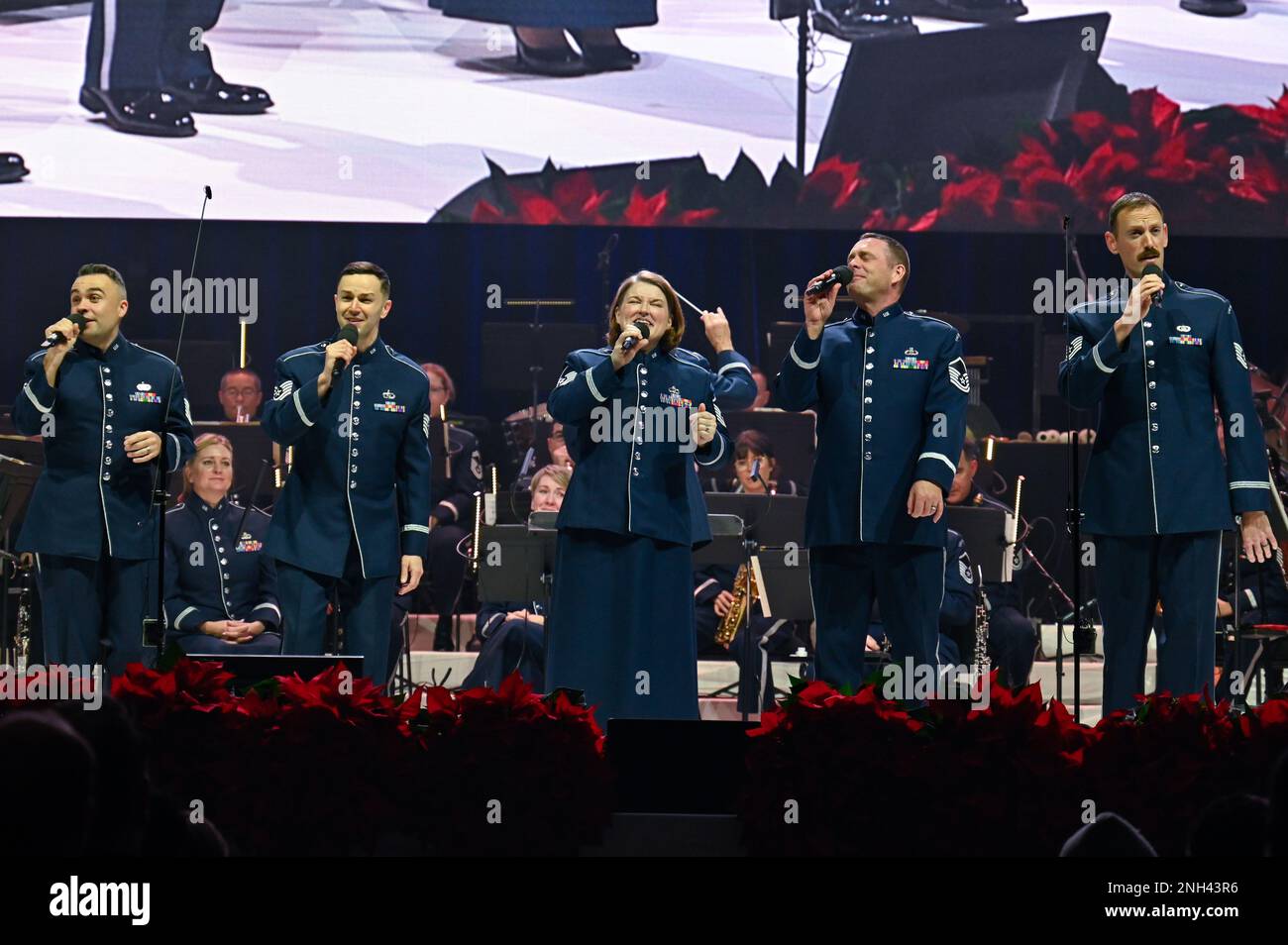 Singers with the Air Force Band perform during a holiday concert at the ...