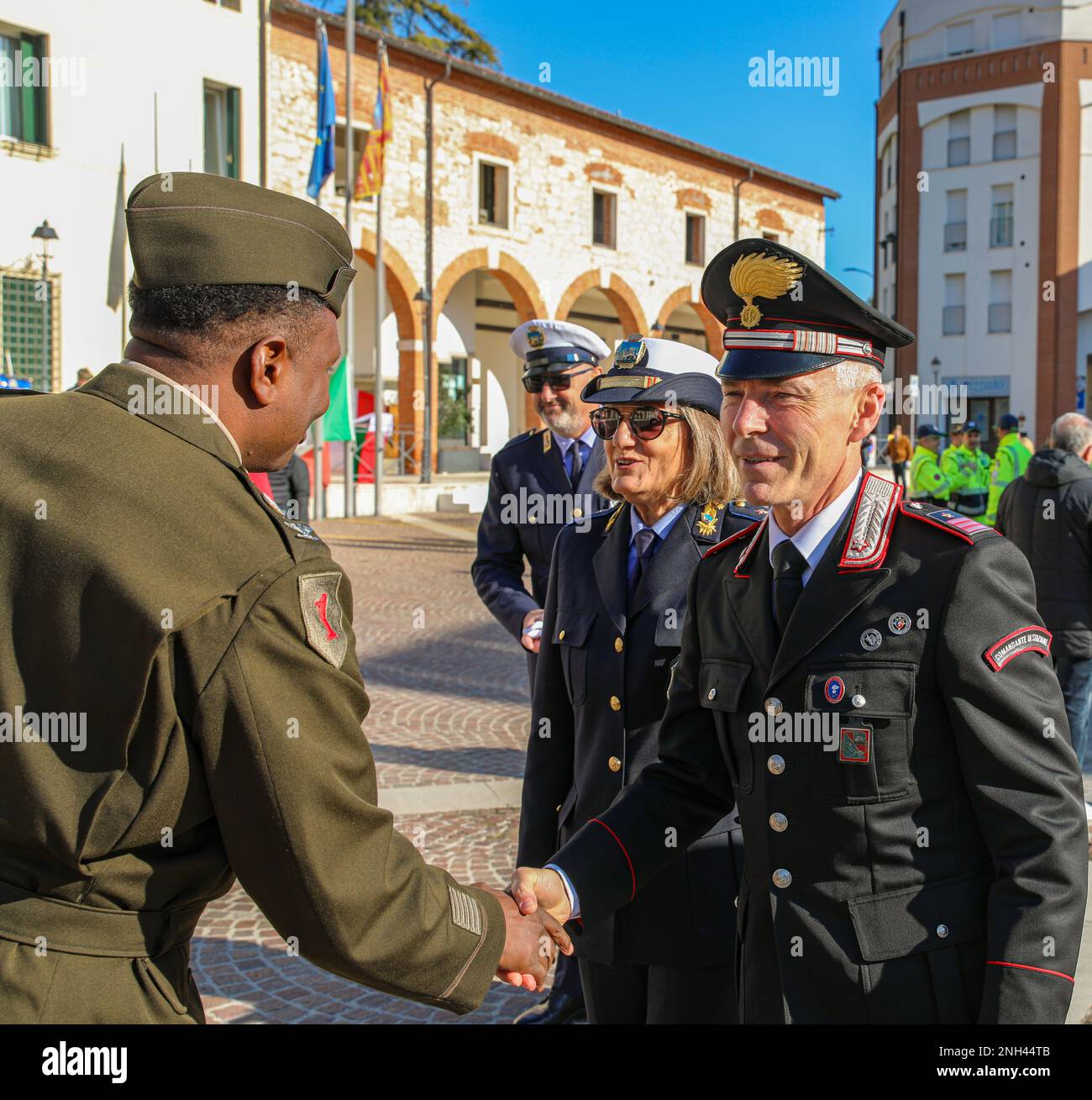Col. Mark Denton greets local Carabiniere commander prior to the ...