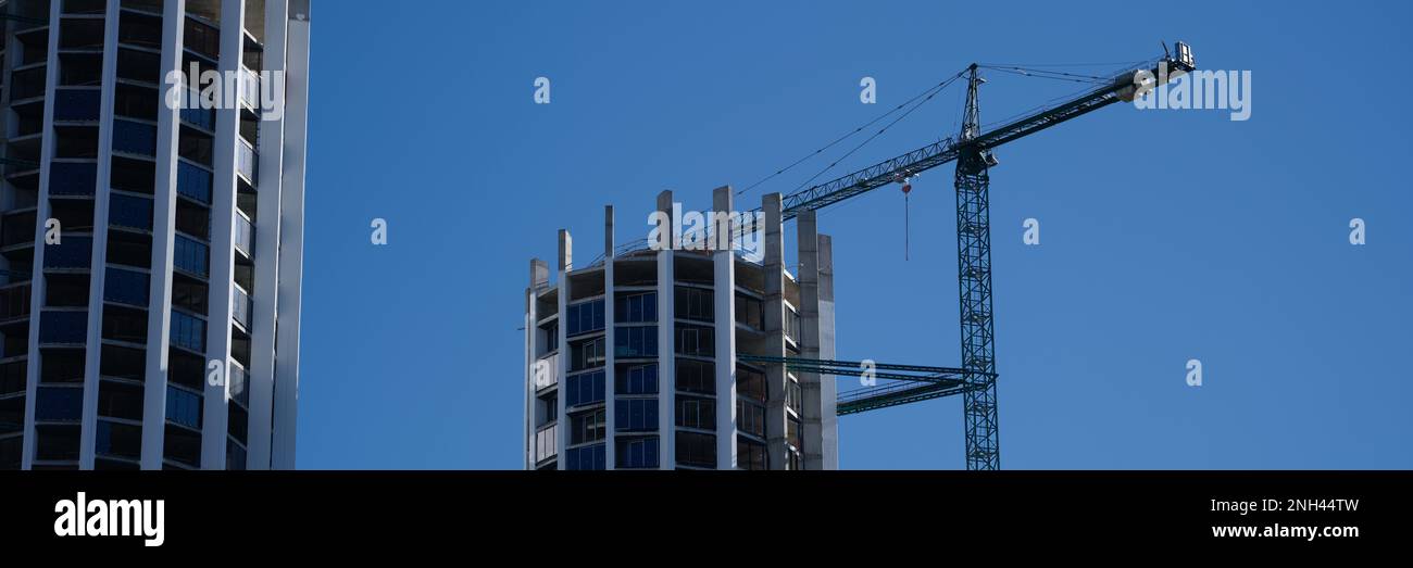 Construction crane and construction of high-rise buildings Stock Photo ...