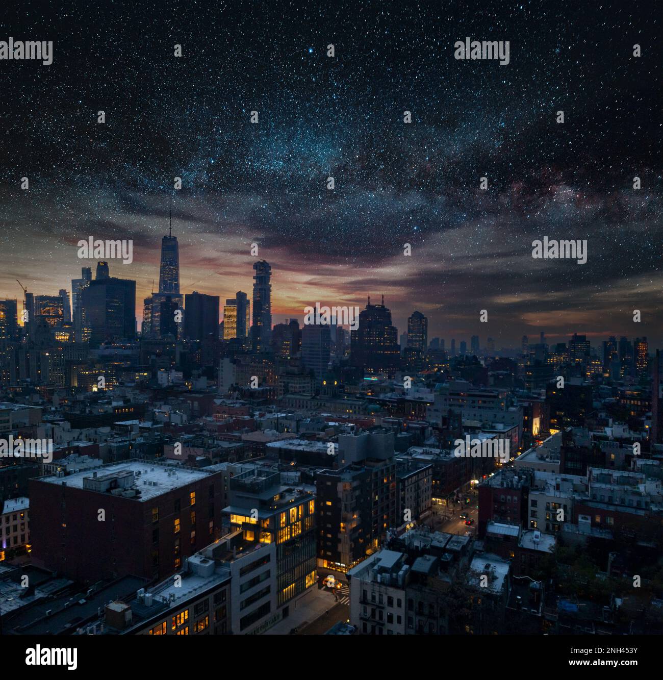 Starry night time sky above the downtown skyline buildings of Manhattan ...