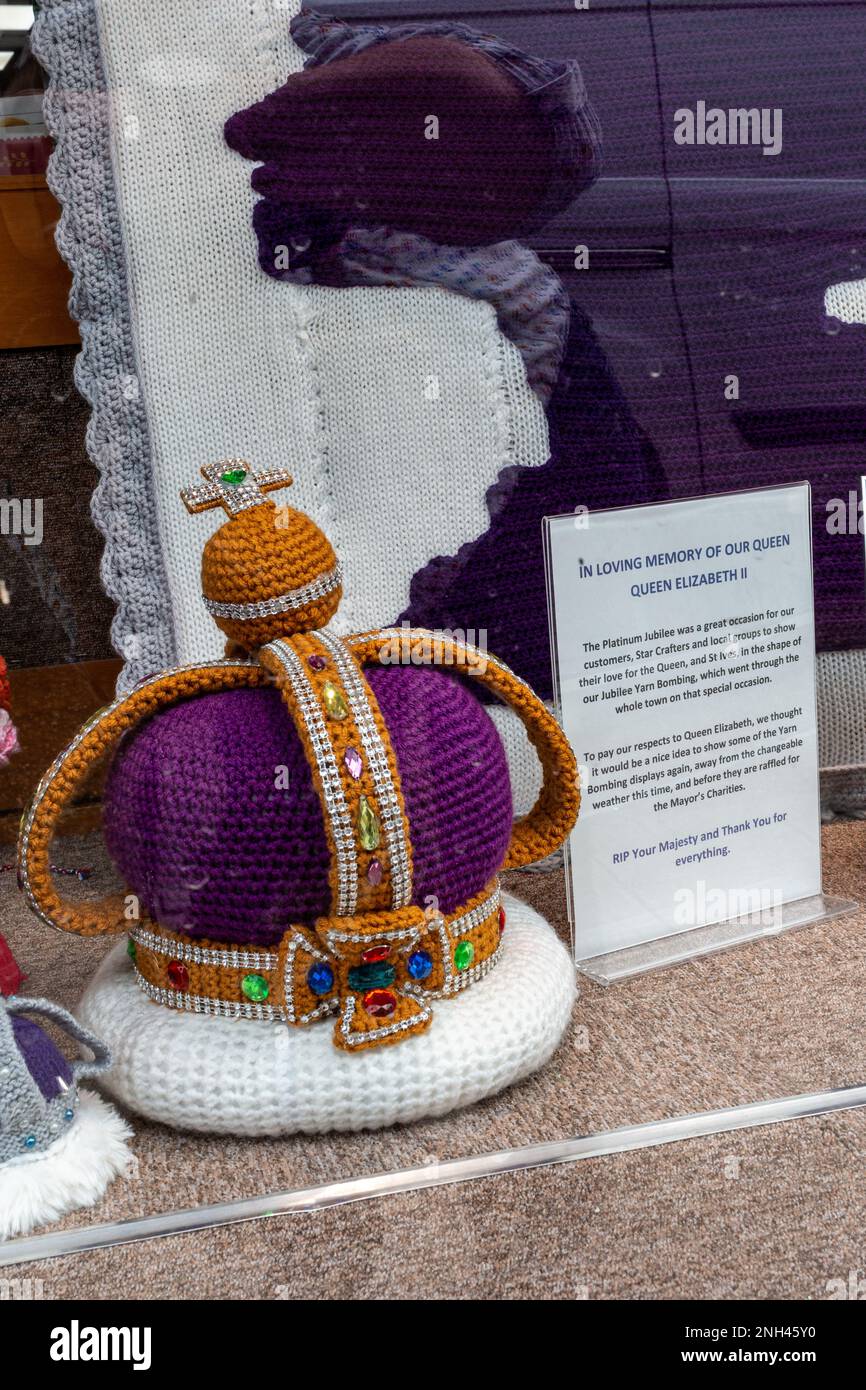 Crocheted crowns are displayed in a shop window to celebrate the life ...