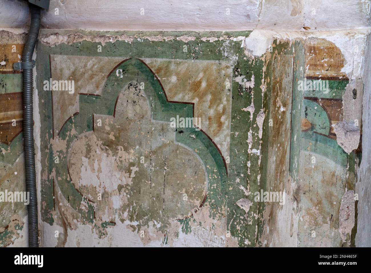 A faded fresco on a damaged plaster wall in the Church of Soledad Vista ...