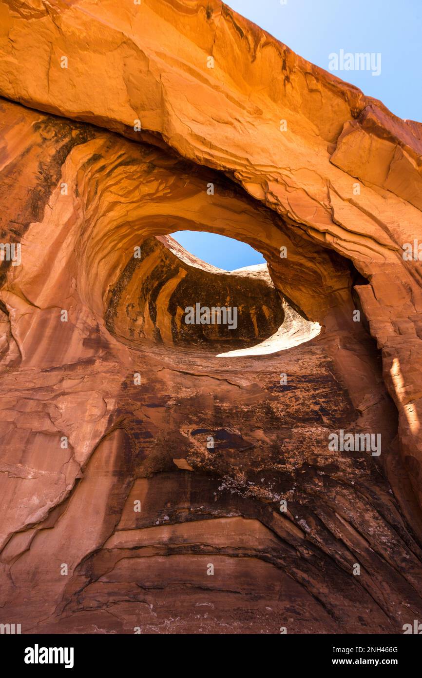 Cummings Arch is a pothole arch south of Moab, Utah. A pothole arch has ...