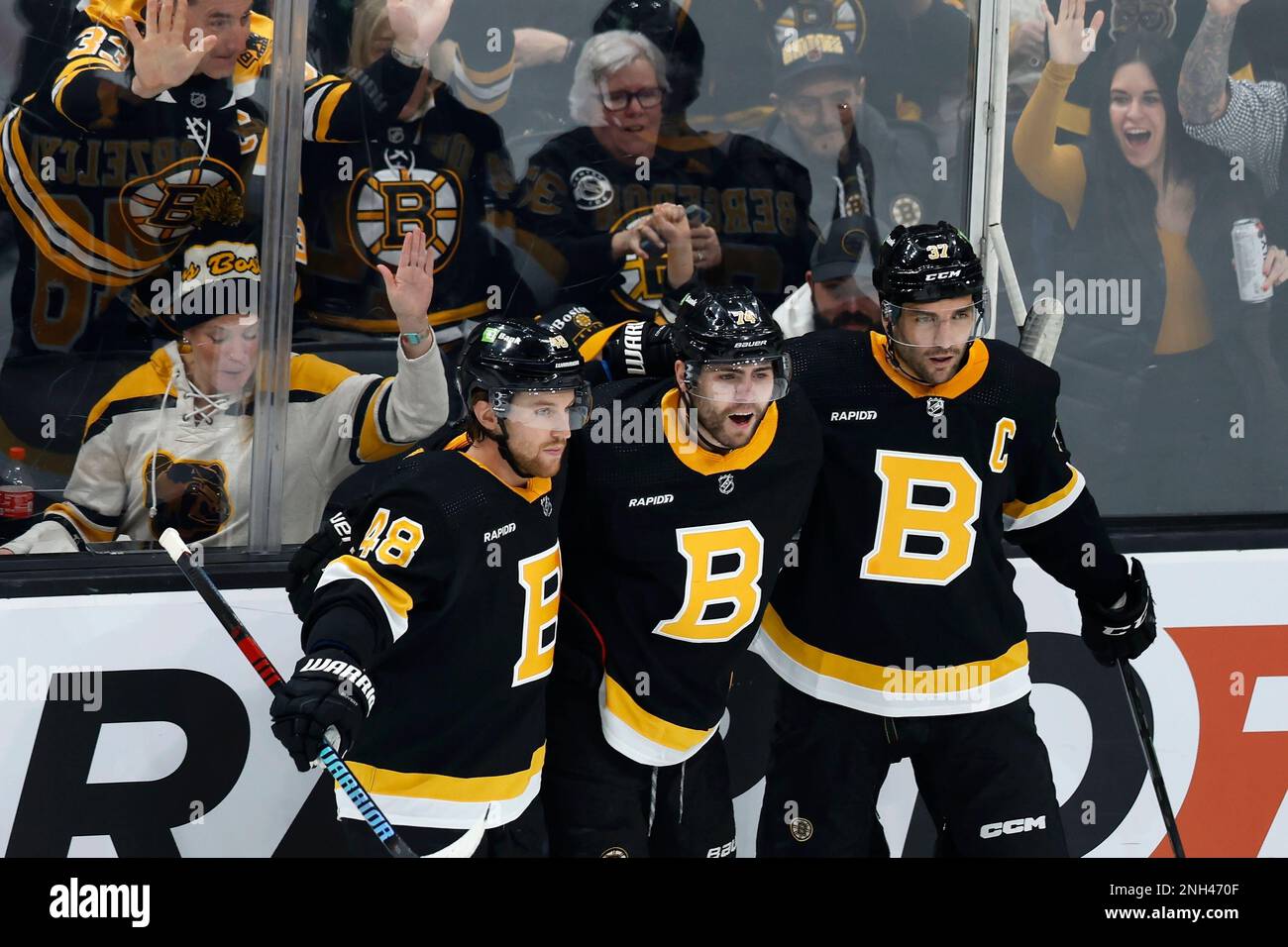 Boston Bruins' Jake DeBrusk (74) celebrates his goal with teammates ...