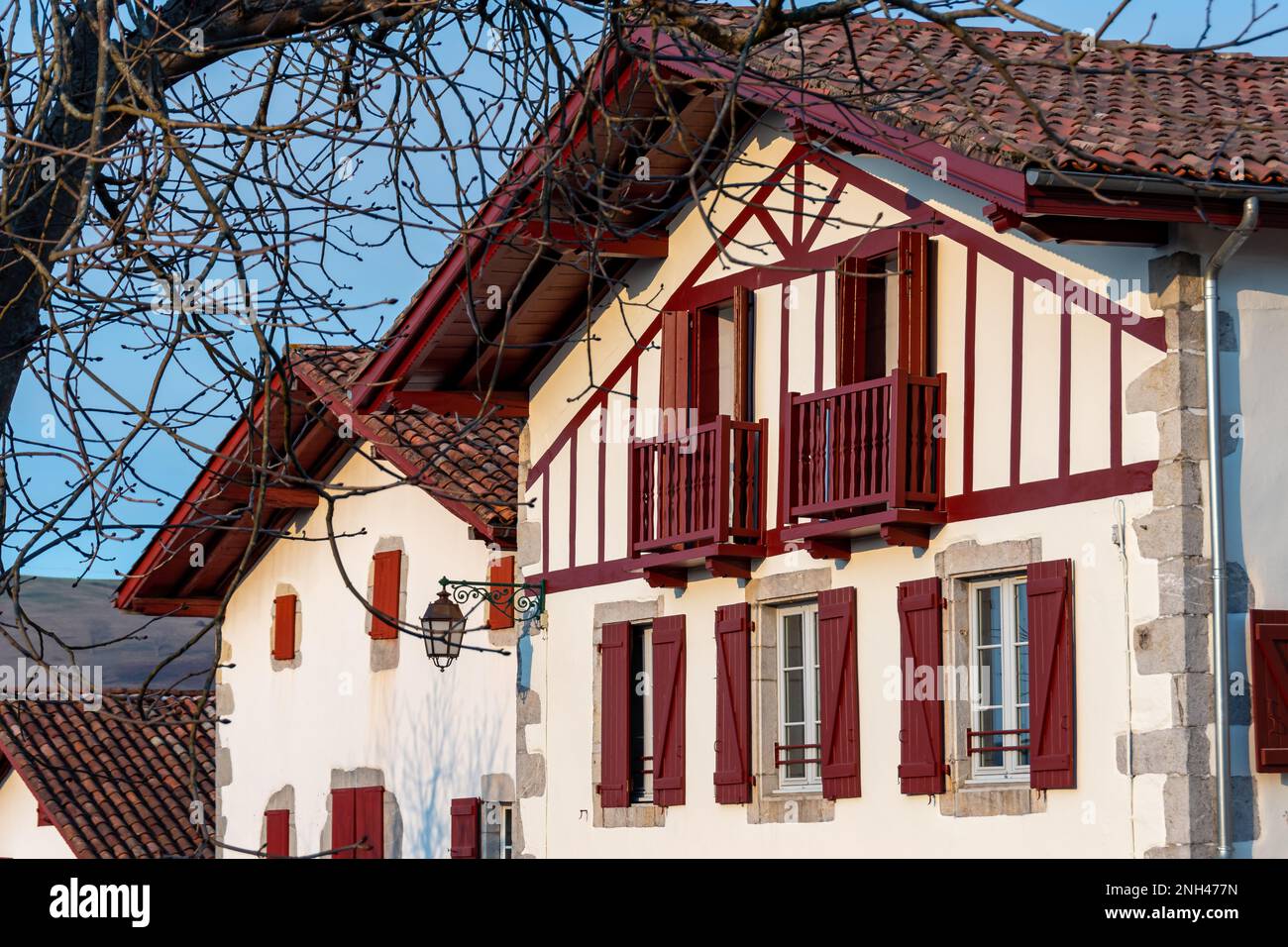 Facades of typical Basque houses in the touristic village of Ainhoa ...