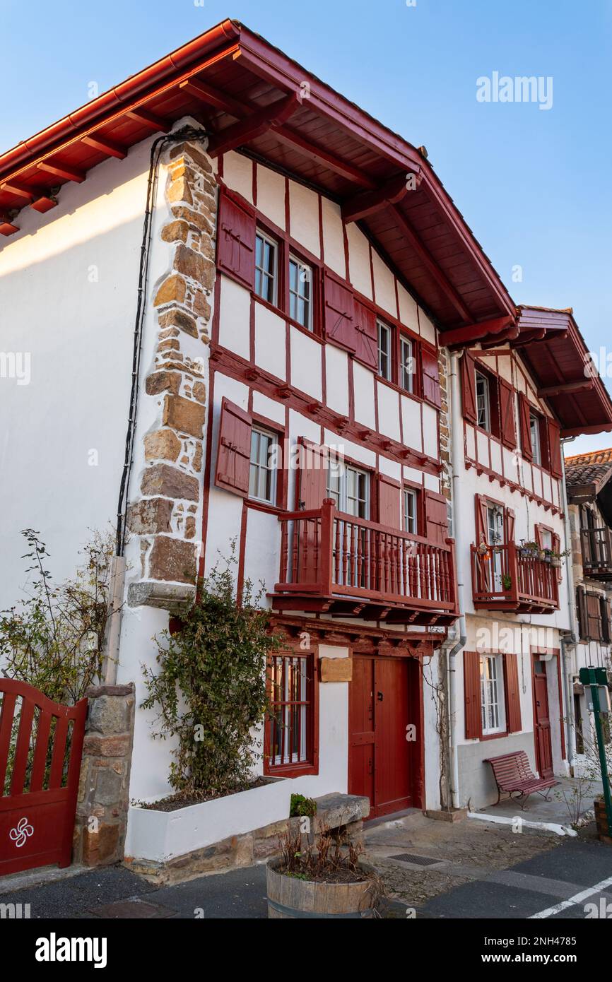 Facades of typical Basque houses in the touristic village of Ainhoa ...
