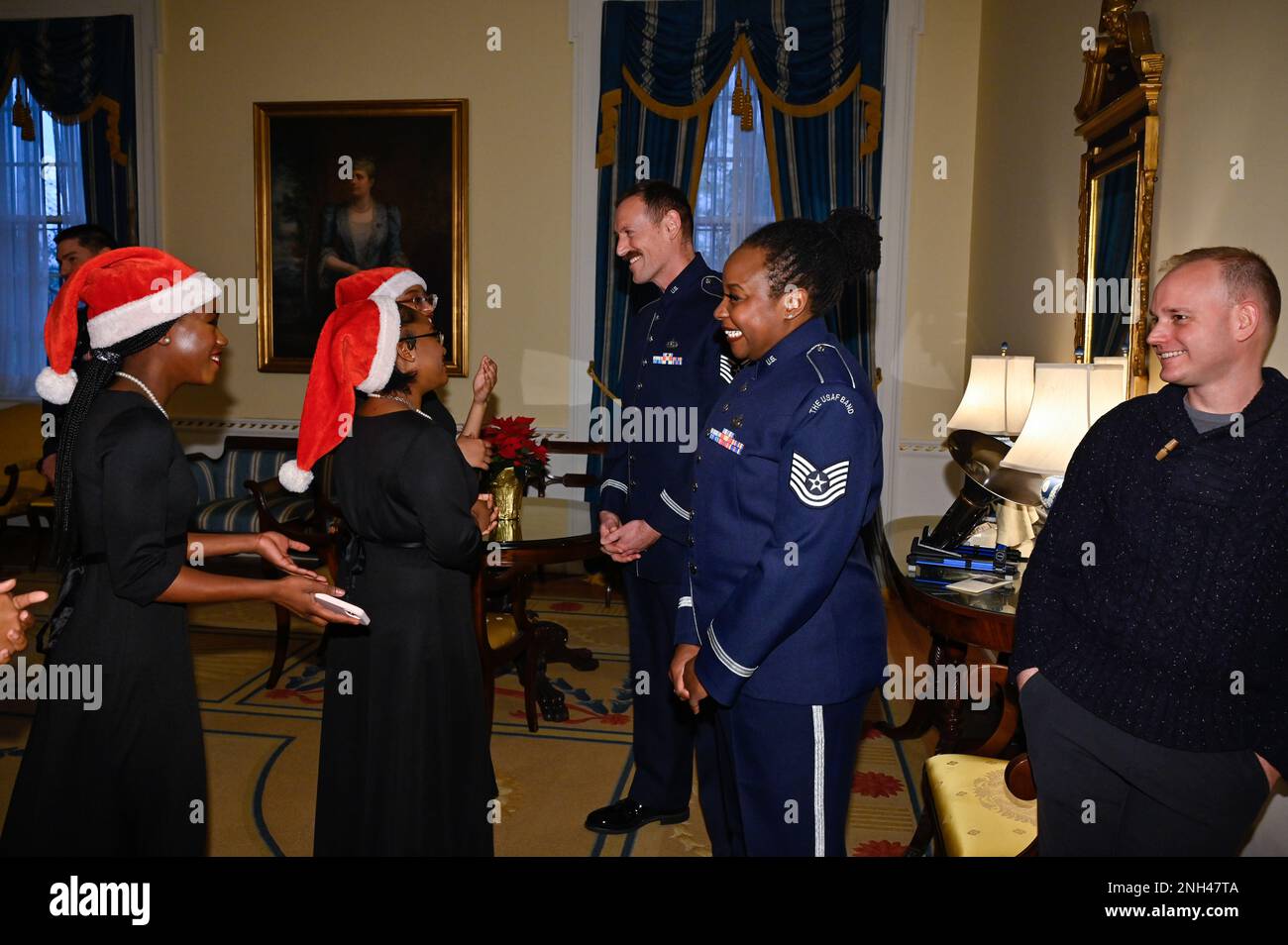 Air Force Band members speak with singers from the Children of the ...