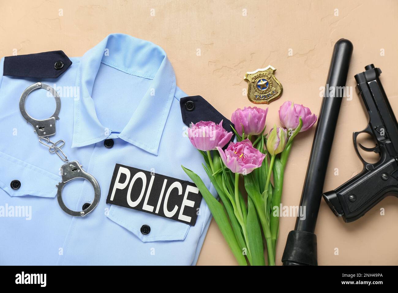 Policeman's uniform with items and tulips on beige background. Hello ...
