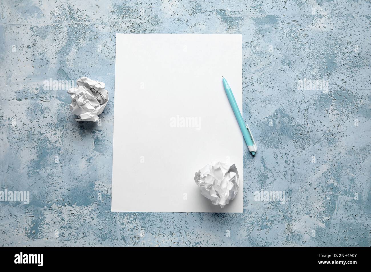 Blank sheet, crumpled paper balls and pen on grunge background. World ...