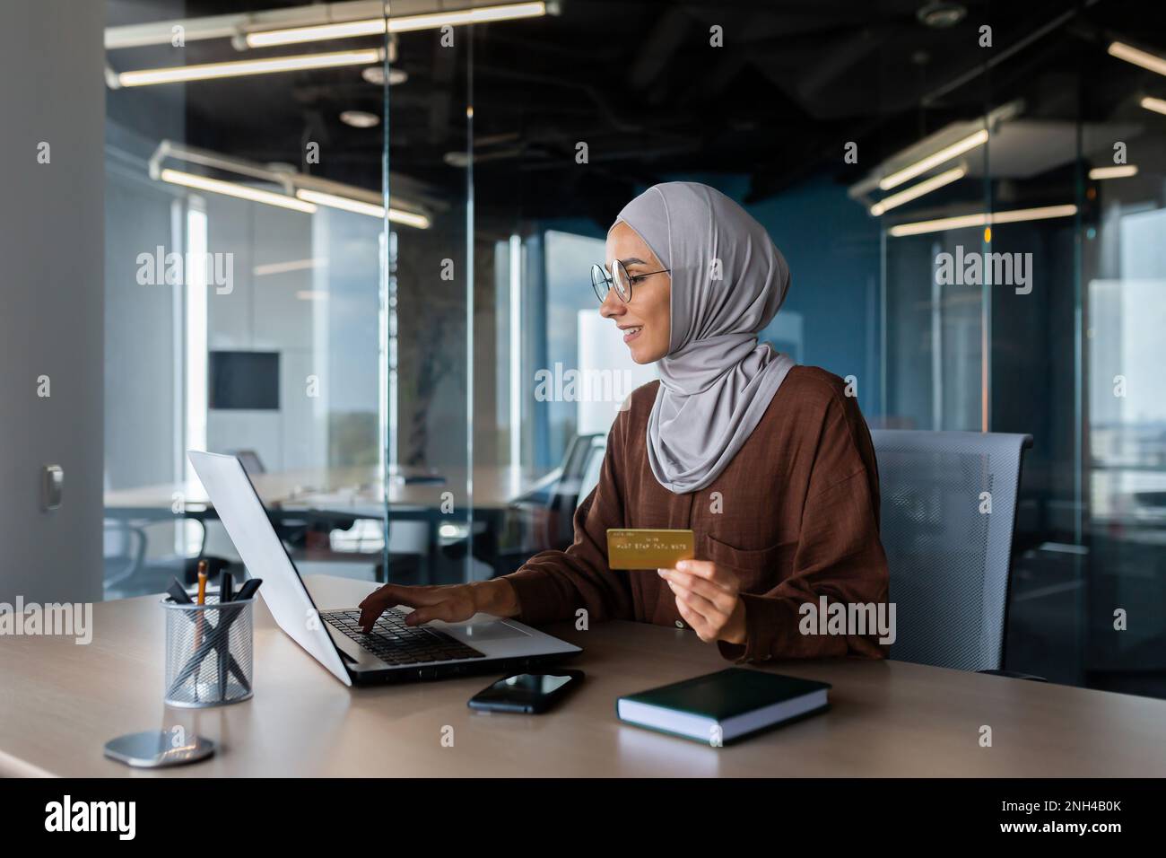 Successful muslim woman in hijab at work inside modern office, business ...