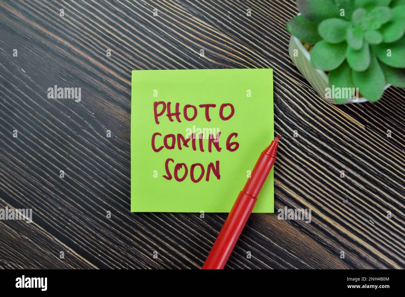 Concept of Photo Coming Soon write on sticky notes isolated on Wooden ...