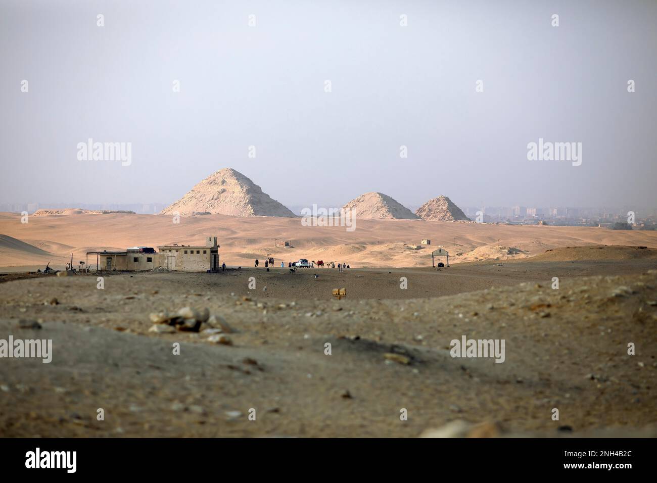 Pyramids at the necropolis of Sakkara, behind in the haze Cairo, al ...
