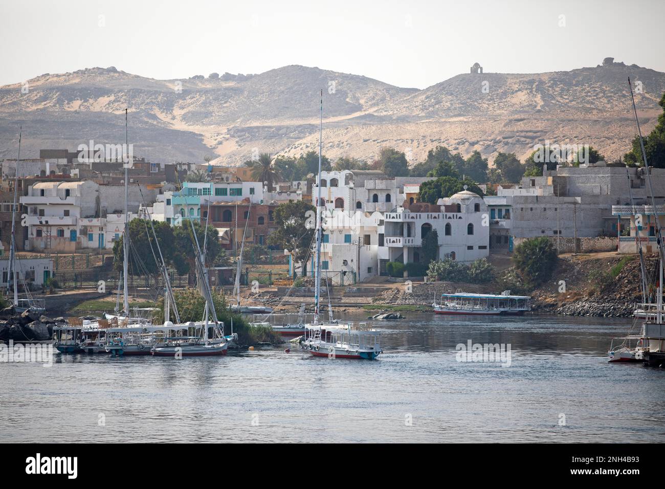 Boats on the Nile, Nubian Desert behind, Aswan, Egypt Stock Photo - Alamy