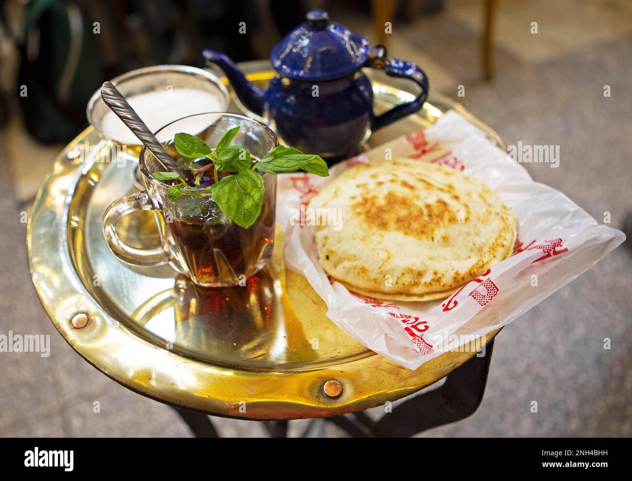 Traditional mint tea and flatbread on a golden tray, Egypt Stock Photo ...