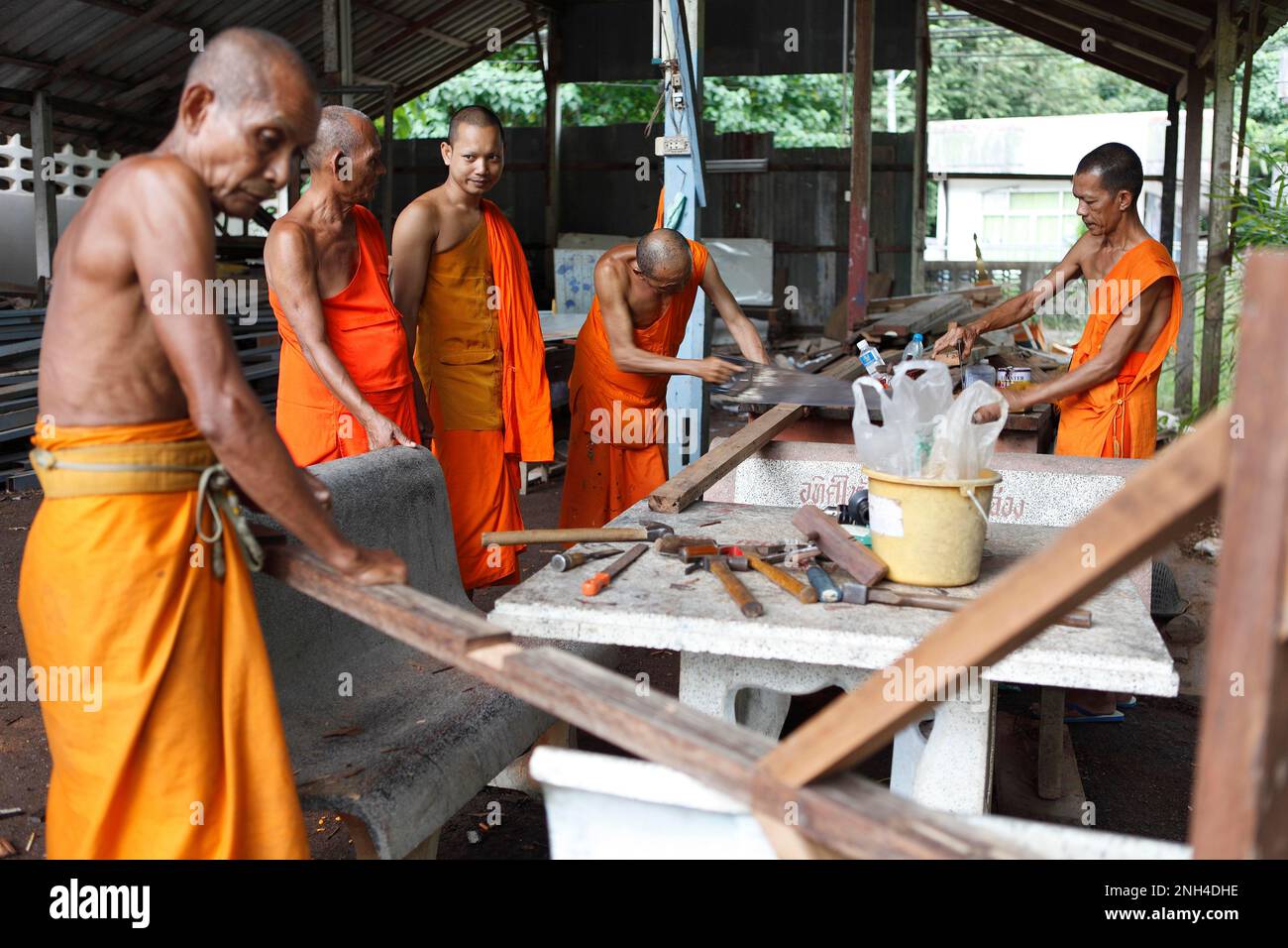 Monks working with wood, Nakao Temple, Trang Town, Trang Province ...