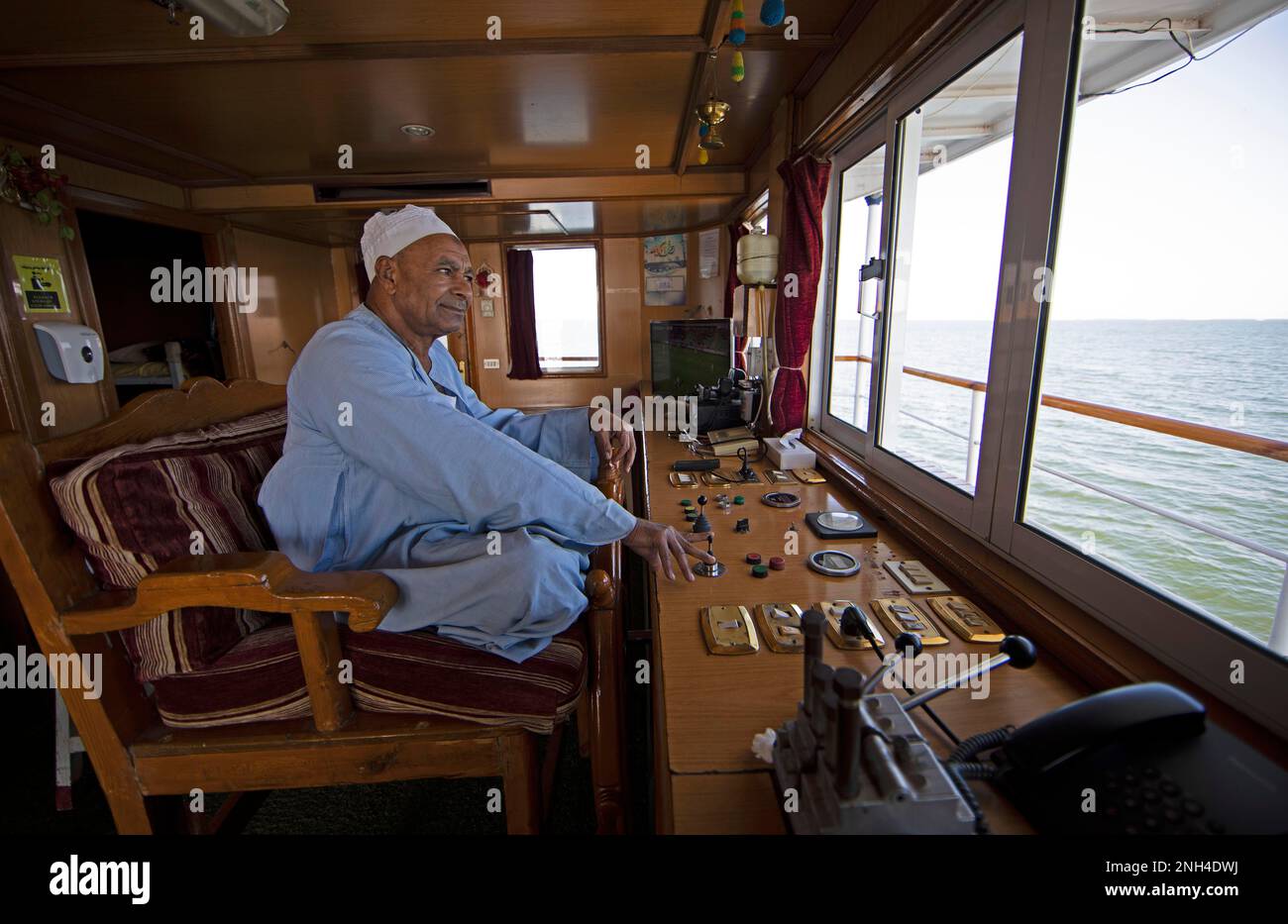 Egyptian captain on the bridge, cruise ship MS Prince Abbas, Lake ...