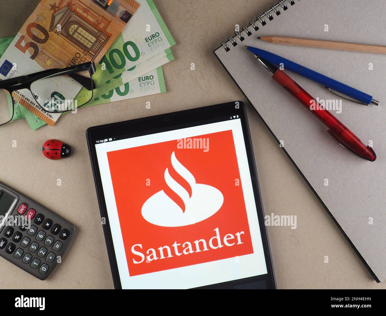 In this photo illustration, Santander Group logo seen displayed on a ...