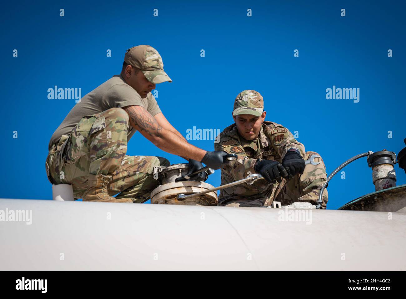Senior Airman Justin Bellivan, left, and Staff Sgt. Christian Munoz ...