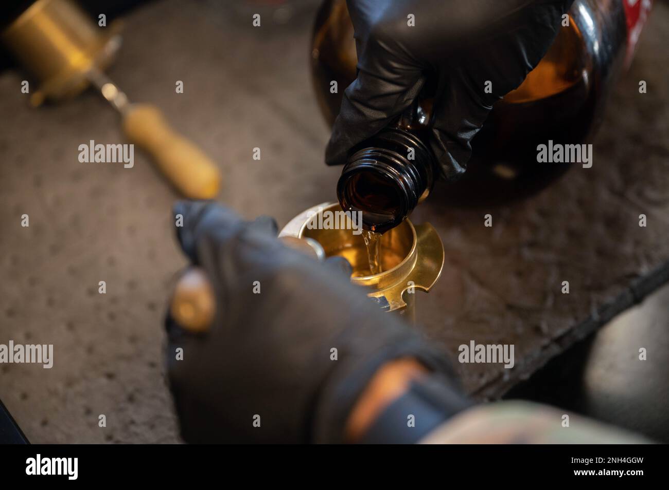 An Airman from the 49th Logistic readiness Squadron fuels laboratory ...