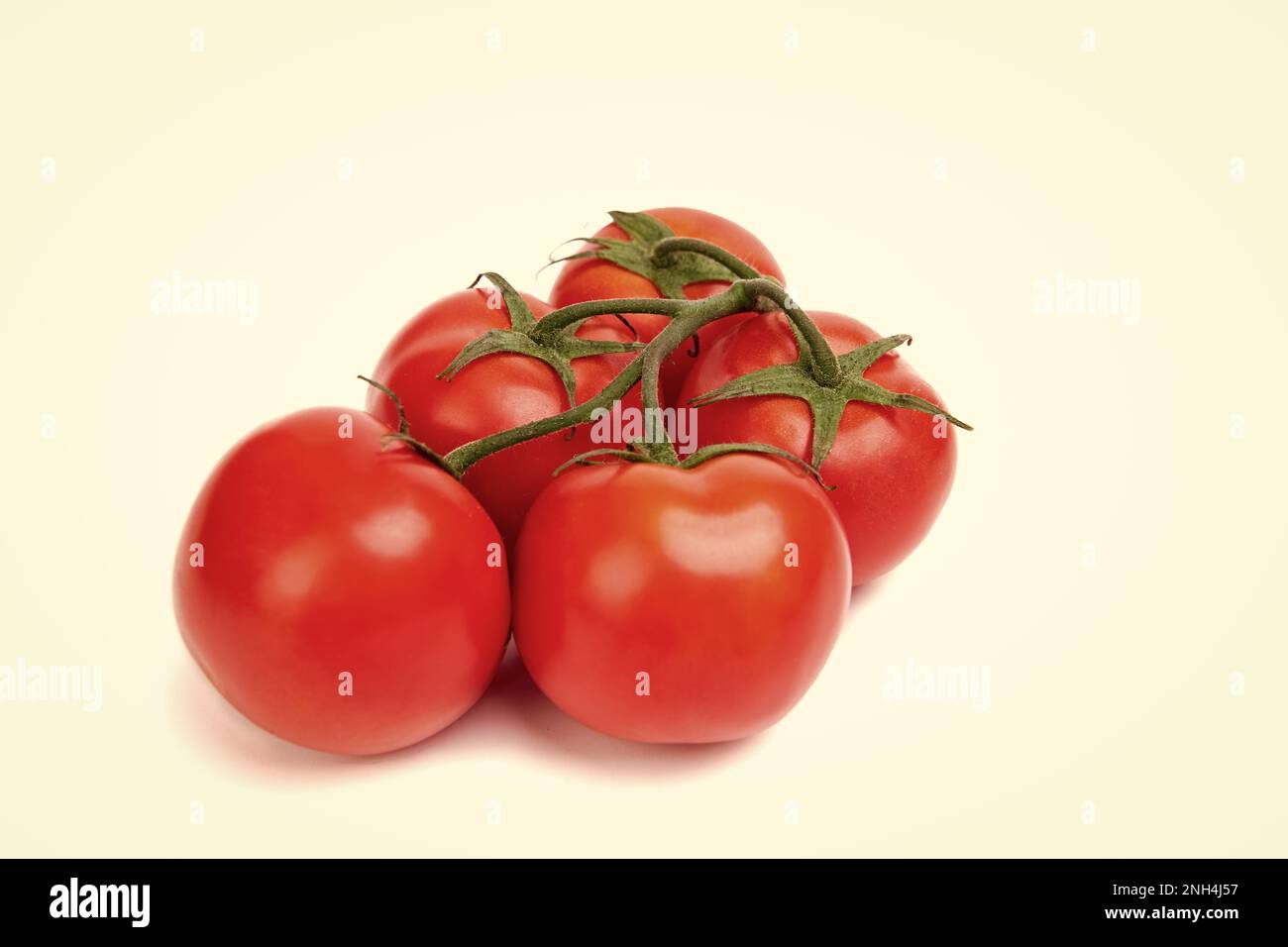 Fresh red cherry tomato cluster isolated on white Stock Photo - Alamy