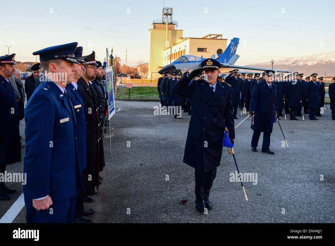 Col. Marco Schiattoni, Italian Air Force base commander, salutes ...