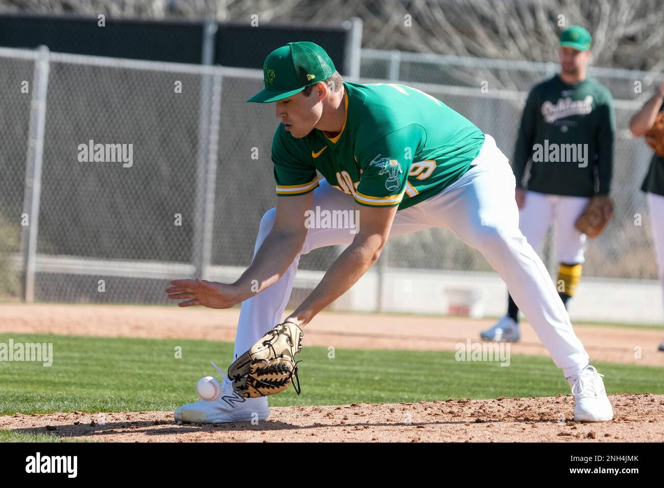 Oakland Athletics' Mason Miller grounds a ball during a spring training ...