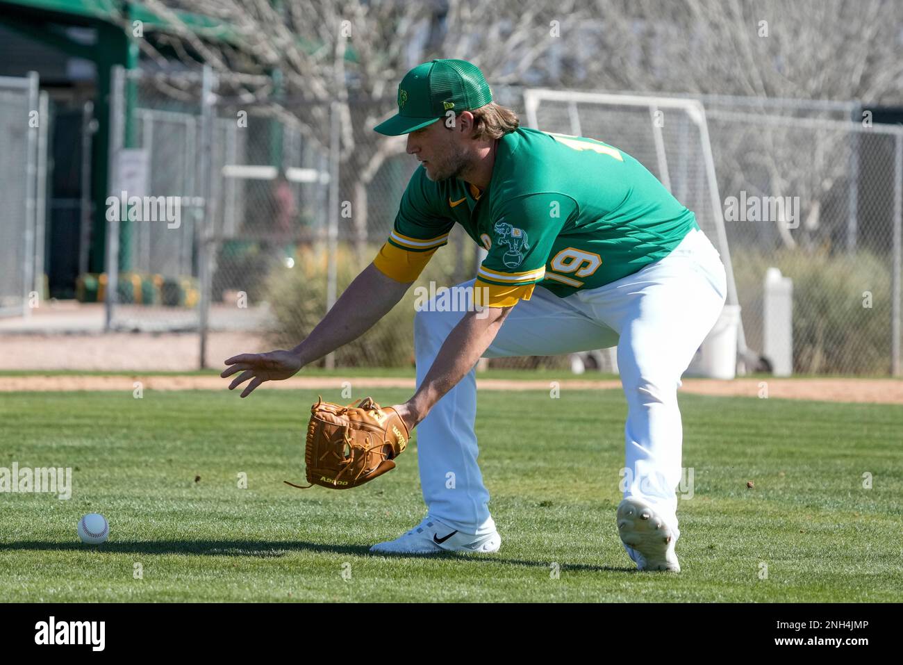 Oakland Athletics' Drew Steckenrider grounds a ball during a spring ...