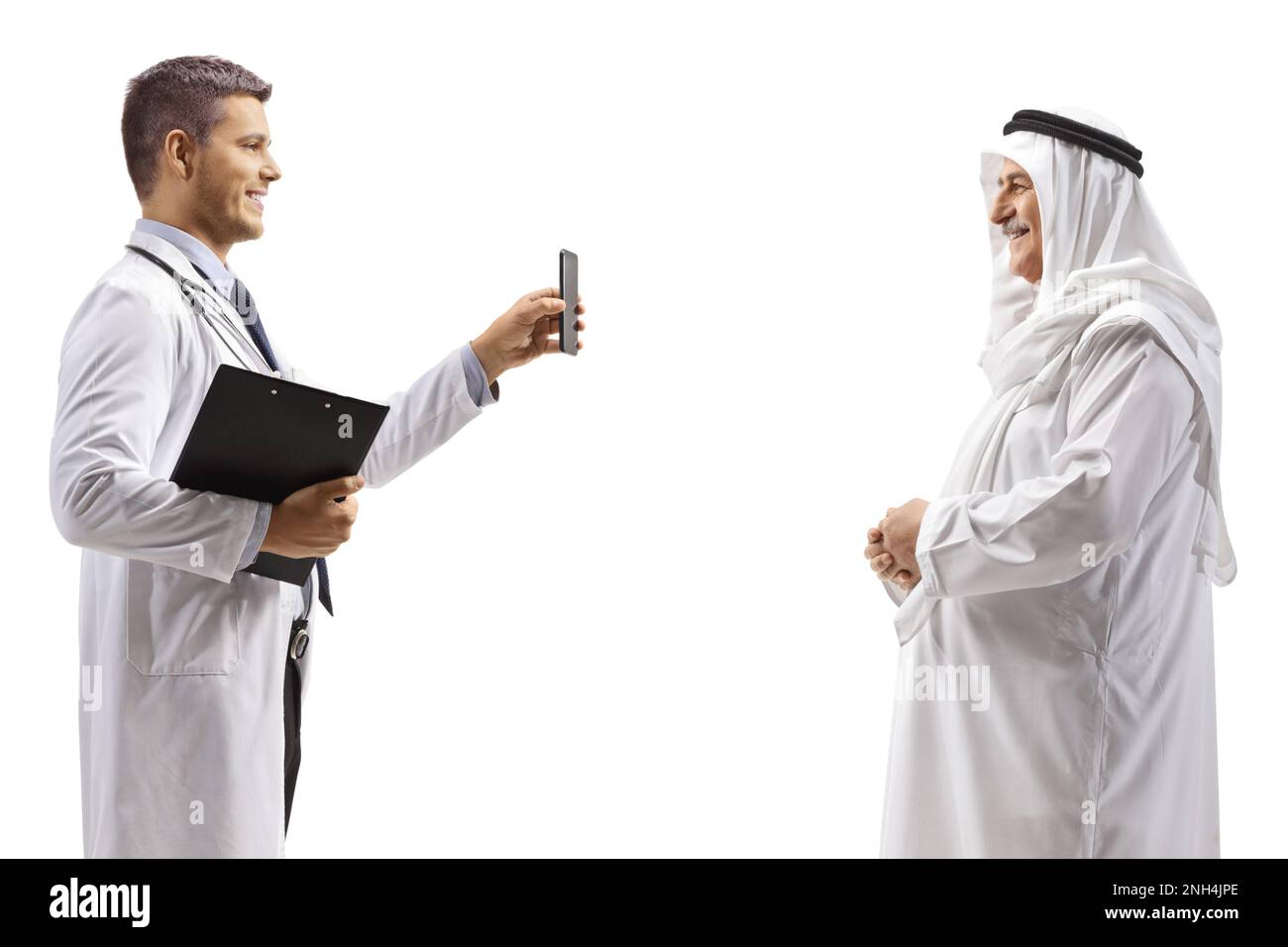 Doctor showing a mobile phone to a mature male arab patient isolated on ...