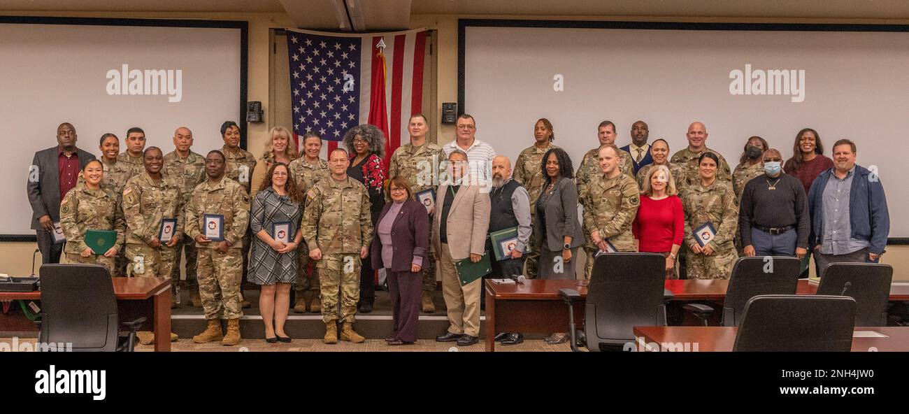 Officers, noncommissioned officers and civilians with the U.S. Army ...