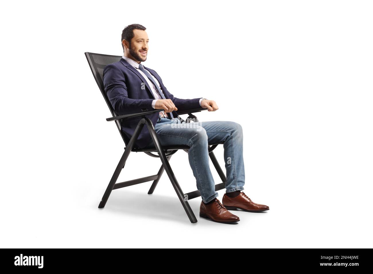 Young man resting in a foldable chair isolated on white background ...